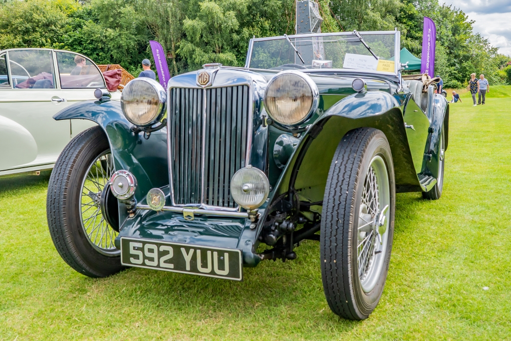 Front view of a classic open top Morgan sports car on display at a ...